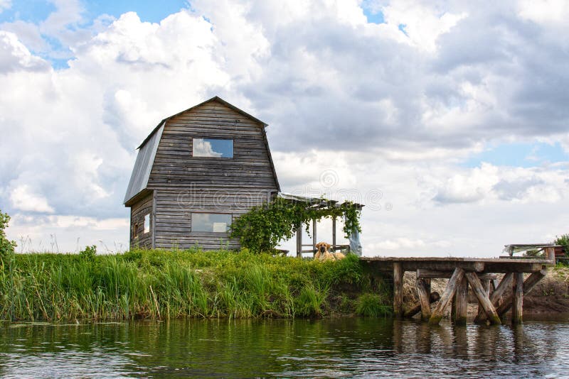 A Small House on the River Bank Stock Photo - Image of bankc, bank ...