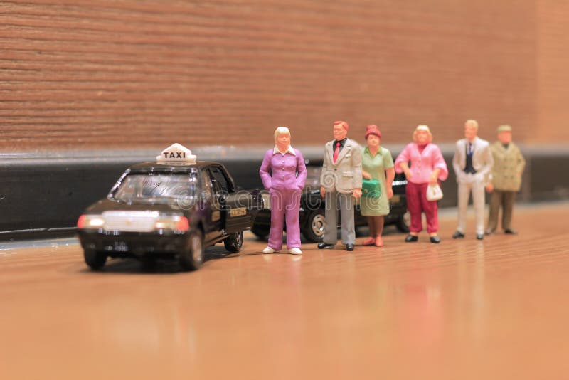 A Small Human Figure and a Taxi Stock Photo - Image of visitors, taxi ...