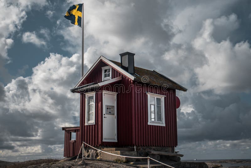 A Small Hut in Front of a Swedish Flag Stock Image - Image of ...