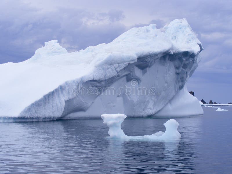 Small Ice Chunk Floating in Front of Large Iceberg in Twillingate ...