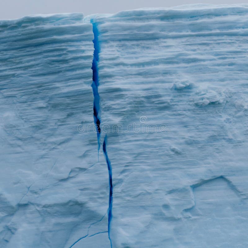 Big Iceberg with Cracks Floating on the Sea Stock Photo - Image of ...