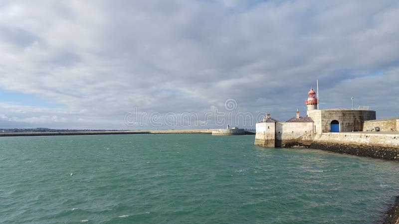 Small Irish Harbor and Lighthouse Stock Image - Image of vessel, fisher ...