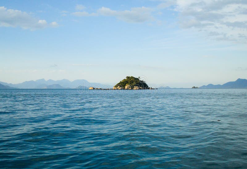 Alone island in the ocean stock photo. Image of ocean - 28424580