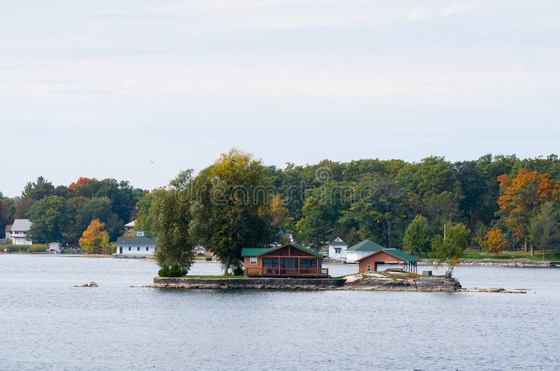 Small Island with a Cottage and a Boathouse Structures Stock Image ...