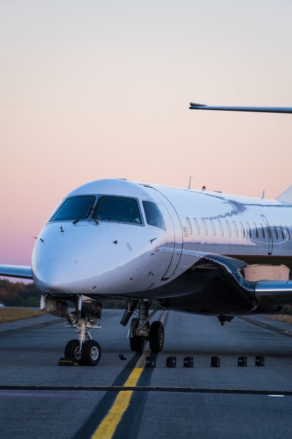 Small Jet Airplane on Runway at Sunset Stock Image - Image of departure ...