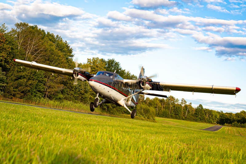 Small Jet Taking Off at Rural Green Runway Field Stock Image - Image of ...