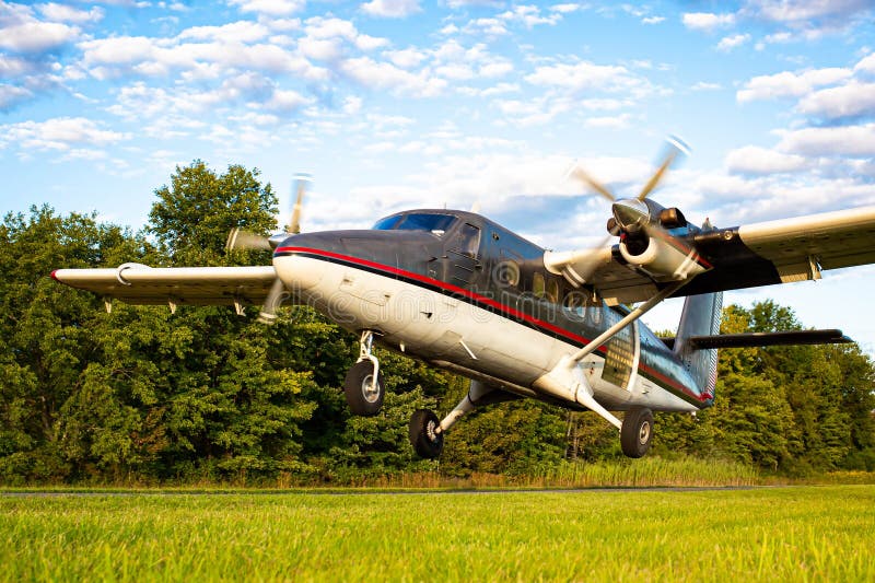Small Jet Taking Off at Rural Green Runway Field Stock Image - Image of ...