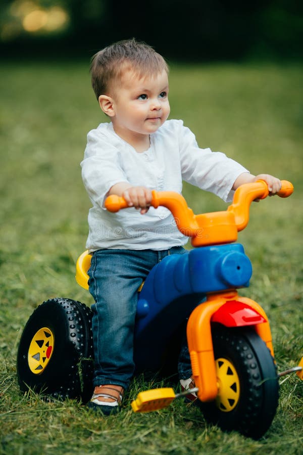 Small kid ride a bicycle stock image. Image of childhood - 72144395