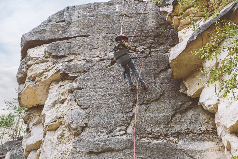 Small Kid at Rock Climbing Training Learning Basics of Abseiling Stock ...