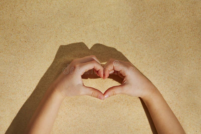 Small Kid`s Hands Making a Heart on Beach Sand Stock Photo - Image of ...