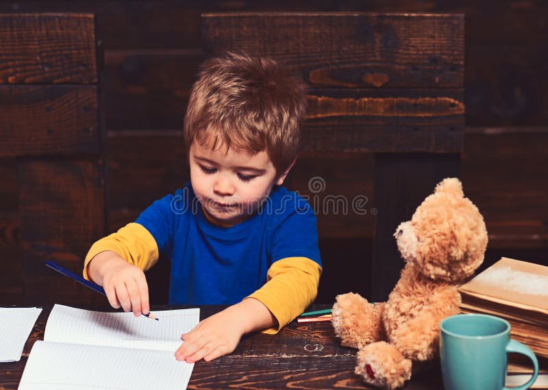 Small Kid Writing in Textbook. Diligent Boy Learning Letters Stock ...