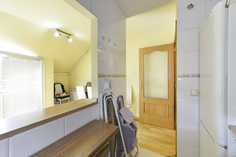 Small Kitchen with Serving Hatch and Living Room with Sloping Ceilings ...