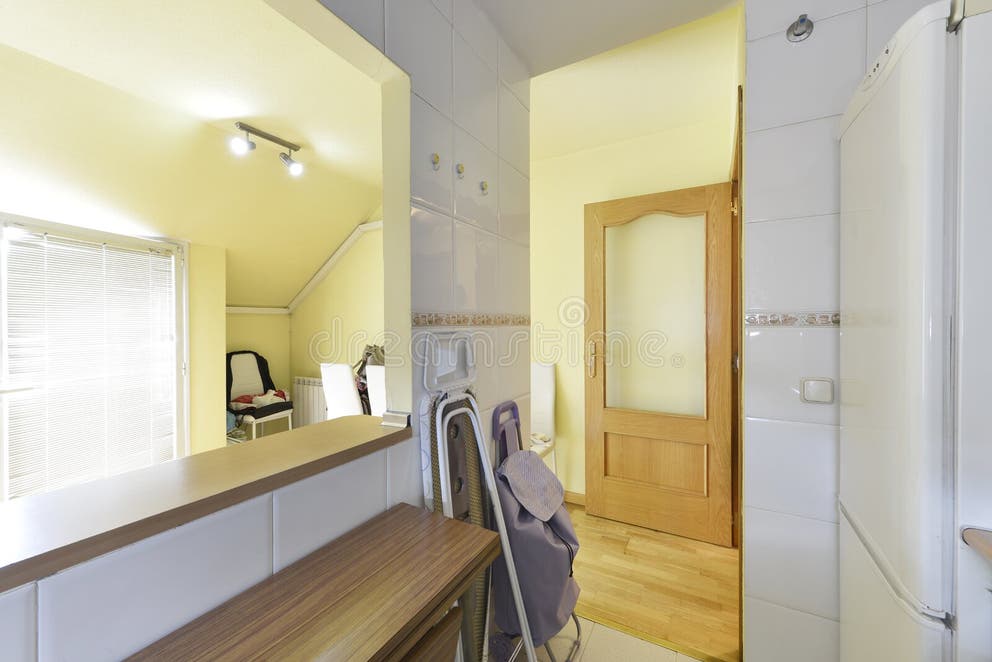 Small Kitchen with Serving Hatch and Living Room with Sloping Ceilings ...