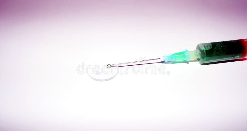 Green Fluid in Syringe with Needle Ready for Test Stock Photo - Image ...