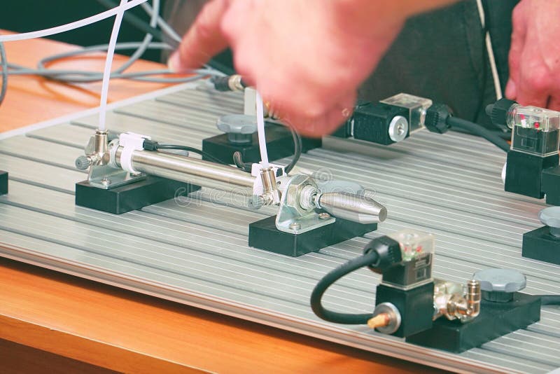 Engineers Connect Wires Control Panel with Small Test Bench for ...