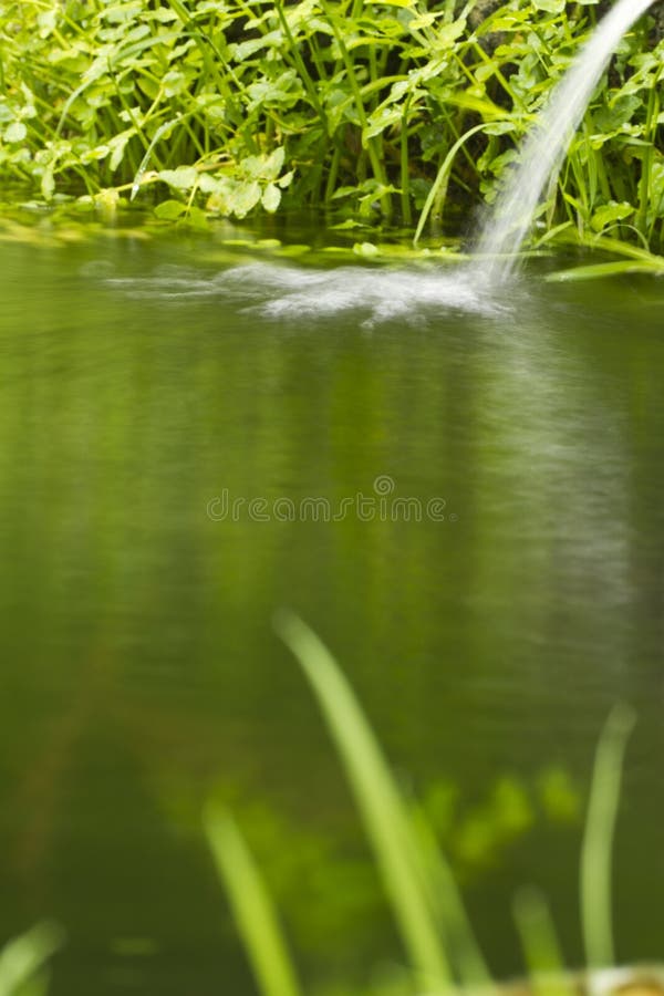 Small lake with waterfall stock image. Image of ground - 23601133