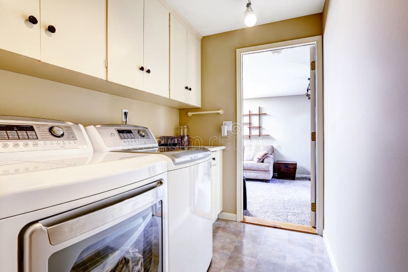 Small Laundry Area with Cabinets Stock Photo - Image of home, laundry ...