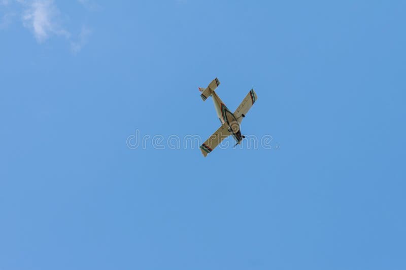 A Small Light Plane Flies in the Clear Sky. View from Below. Stock ...