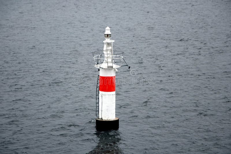 Small Lighthouse In Front Of The Sea, Over The Rocks In Beautiful ...