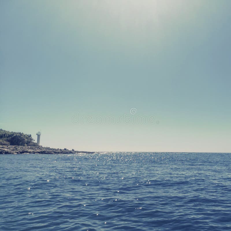 Small Lighthouse on Small Island Blue Sky Stock Photo - Image of ...