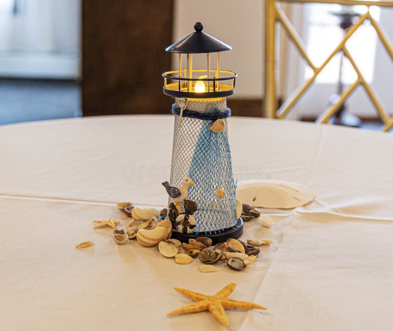 Decorative Lighthouse on a Table with Shells Stock Photo - Image of ...