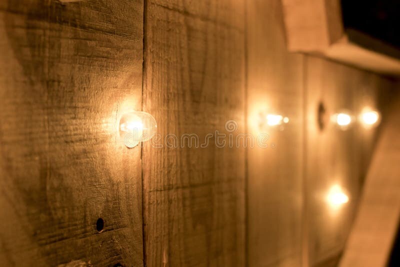 Small Lights in a Row on a Wooden Surface. Stock Image - Image of ...