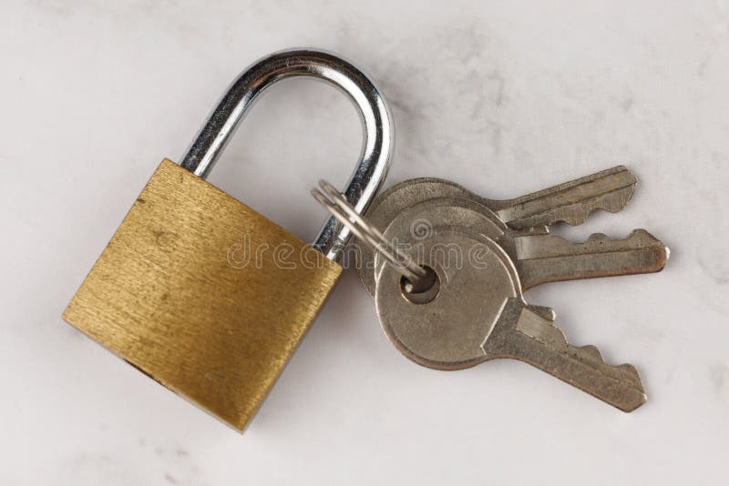 Small Lock with Keys. Locked Golden Padlock on the White Background ...