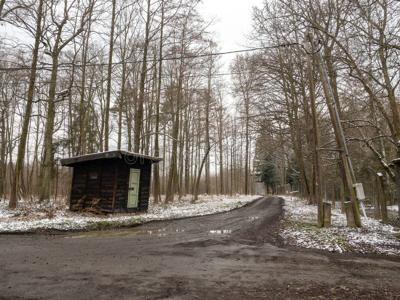 Small Lodge in the Forest by a Muddy Road. Stock Image - Image of cabin ...