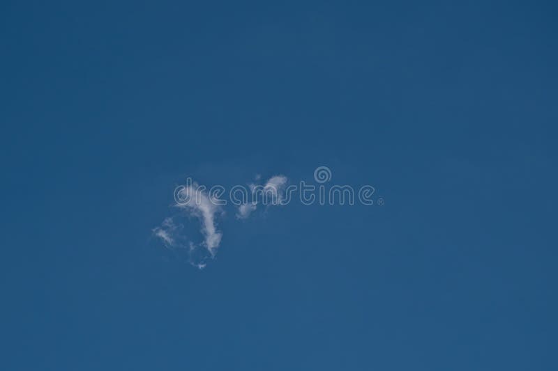 Small Lone Cirrus Cloud in Deep Blue Sky Stock Photo - Image of cloud ...