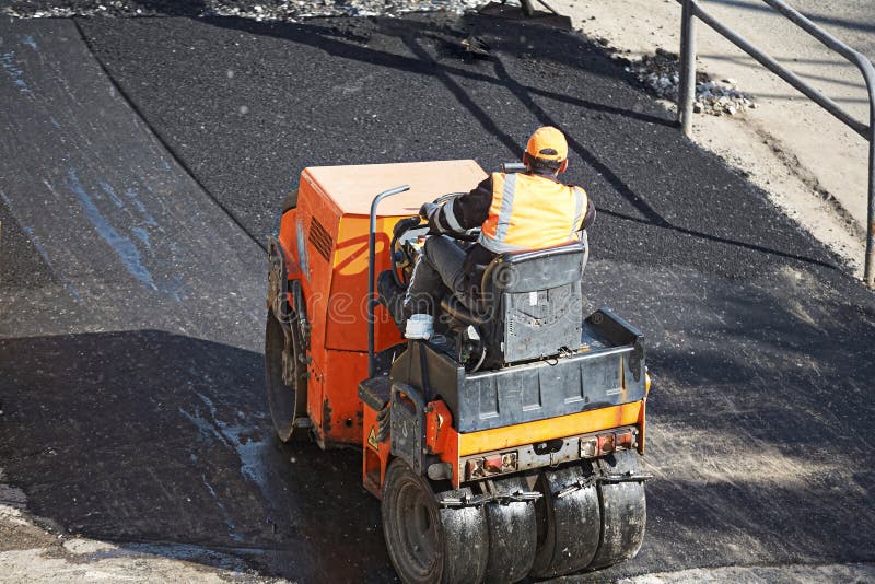 A Small Machine for Laying a New Asphalt. Stock Photo - Image of ...