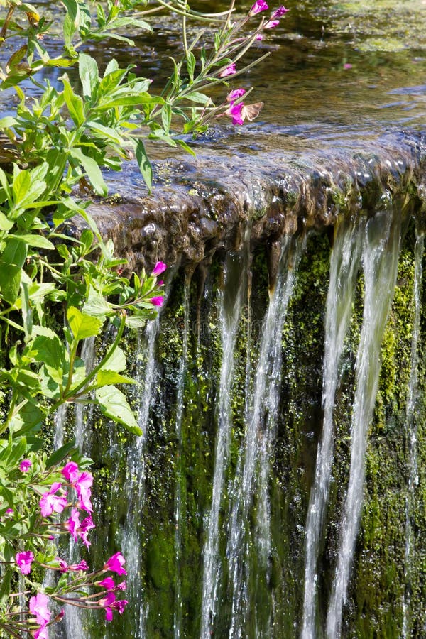 Small Man Made Waterfall in Countryside Stock Image - Image of logs ...