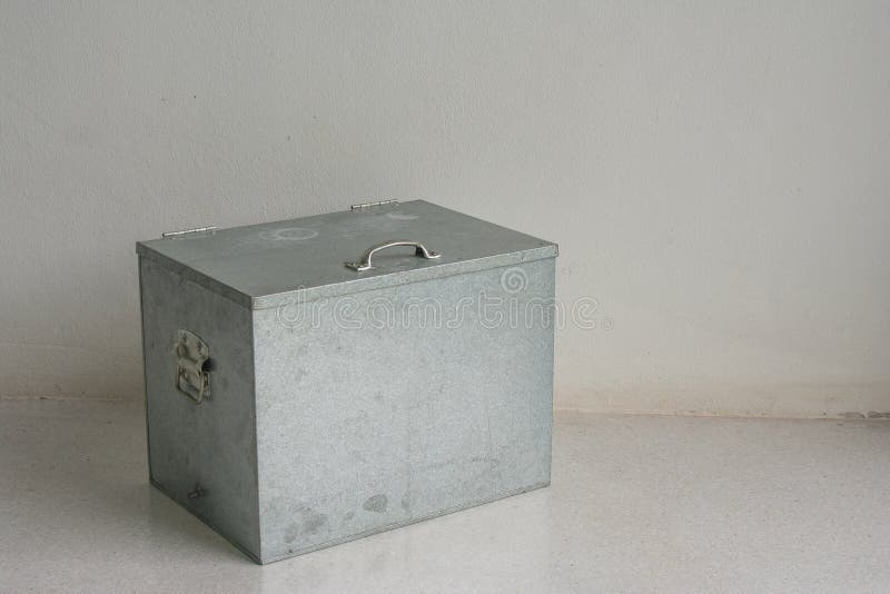 Small Metal Container on Concrete Floor in White Room. Stock Photo ...
