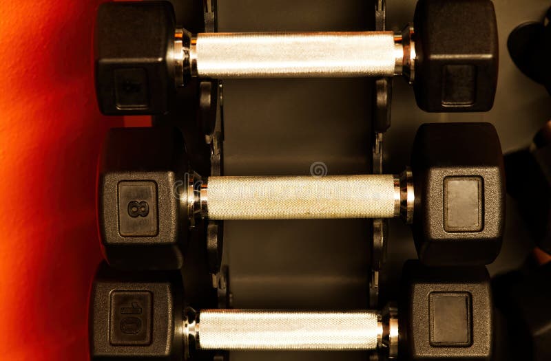 Small Metal Free Weights Sitting in Rack Stock Image - Image of black ...