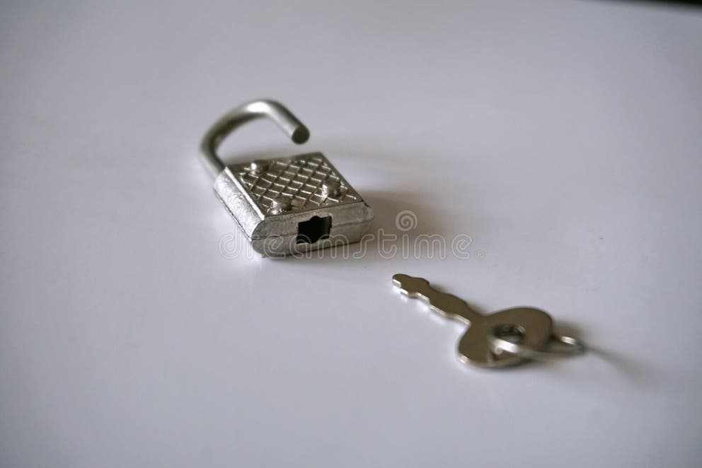 Small Metal Key Opening a Lock Stock Photo - Image of access ...