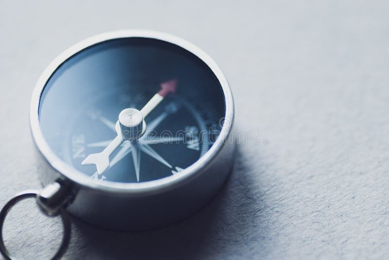 Small Metallic Magnetic Compass on Textured Grey Stock Photo - Image of ...