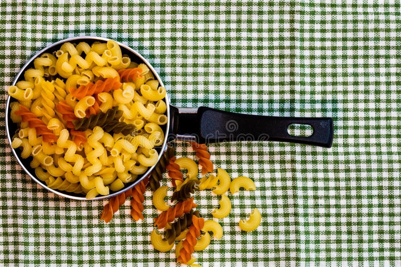 Small Mini Frying Pan with Tricolor Raw Fusilli Pasta in a Rustic ...
