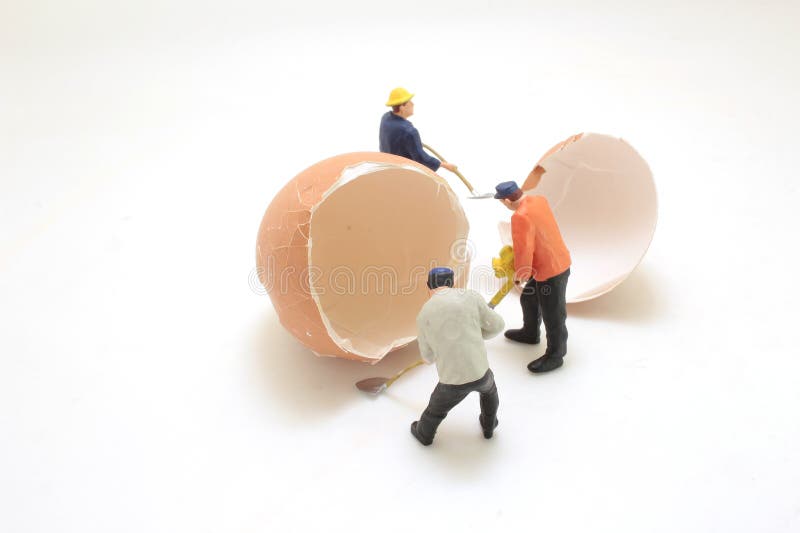 A Small Model Human Figure Cleaning Broken of Chicken Shell Stock Photo ...