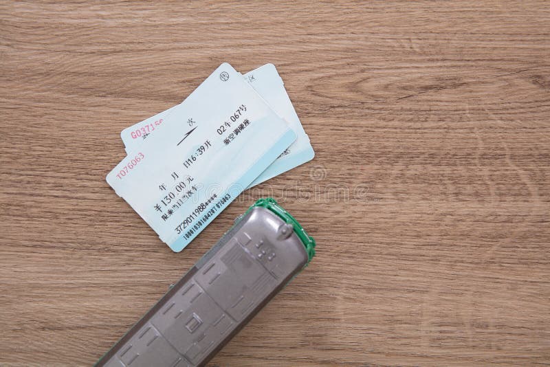 Small Model Train and Two Train Tickets on the Table Stock Photo ...