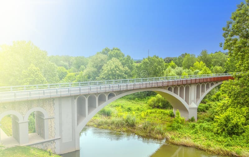 Small Modern Bridge Across the River in Soft Sunlight Stock Photo ...