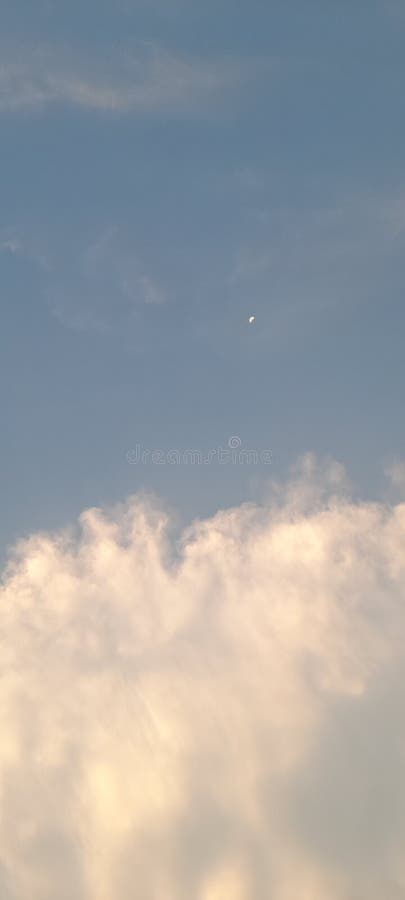 A Small Moon that Appears in the Afternoon when the Sky is Blue and the ...