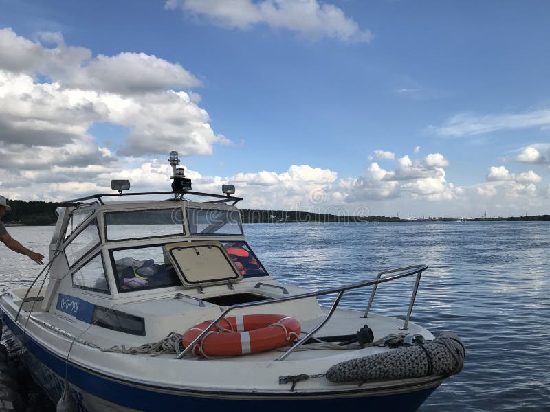 A Small Motor Boat at the Pier on the River. Stock Image - Image of ...