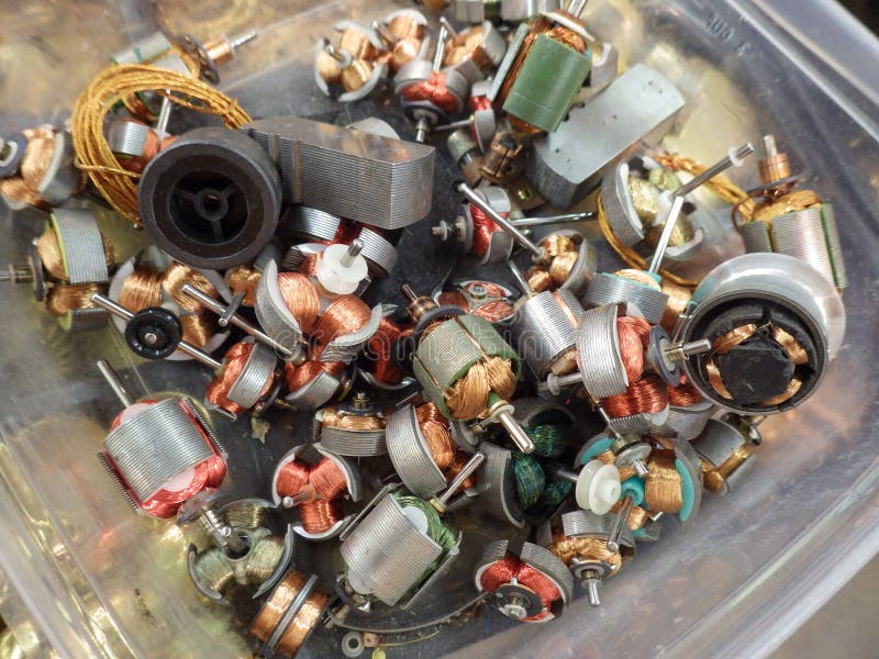 Small Electric Motors in Container Showing Windings and Shafts Stock ...