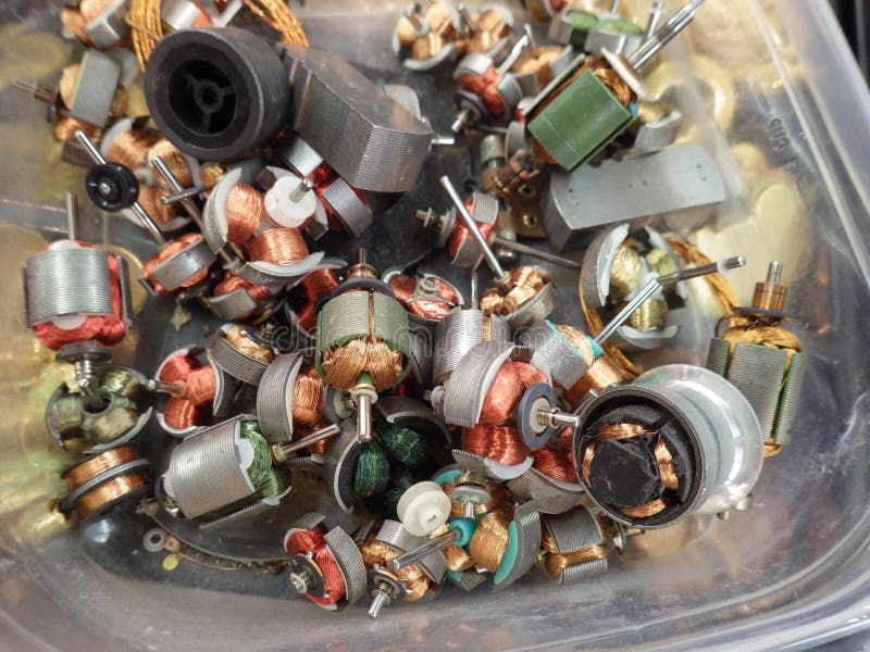 Small Electric Motors in Container Showing Windings and Shafts Stock ...