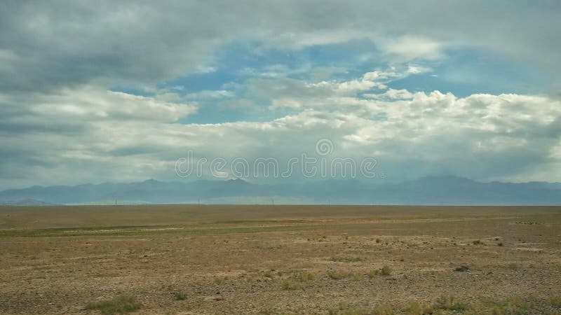 A Small Mountain Range is Visible in the Distance from the Steppe ...