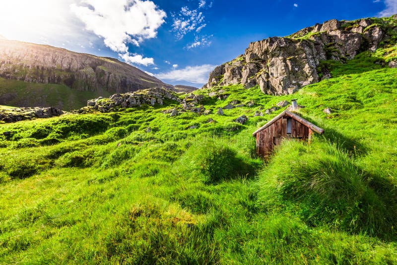 Small Mountain Shack on Grassy Hill, Iceland Stock Photo - Image of ...