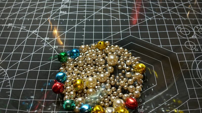 Small Multi-colored Beads are Poured into a Glass Bowl Stock Footage ...