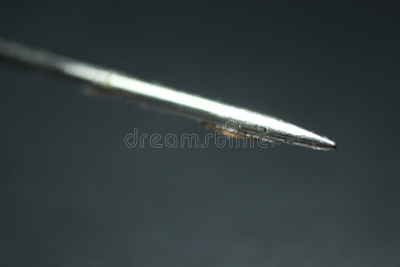 Small Needle with Empty Eyelet, Isolated Over the Black Background ...