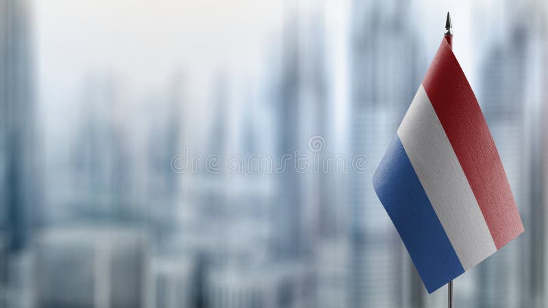 A Small Netherlands Flag on an Abstract Blurry Background Stock ...