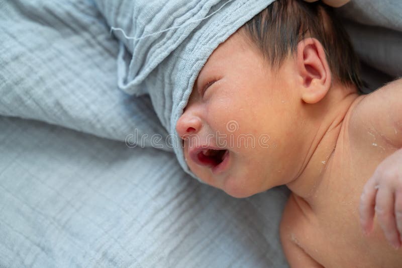 A Small Newborn Boy is Crying.Small Baby 1 Week Old. Stock Image ...