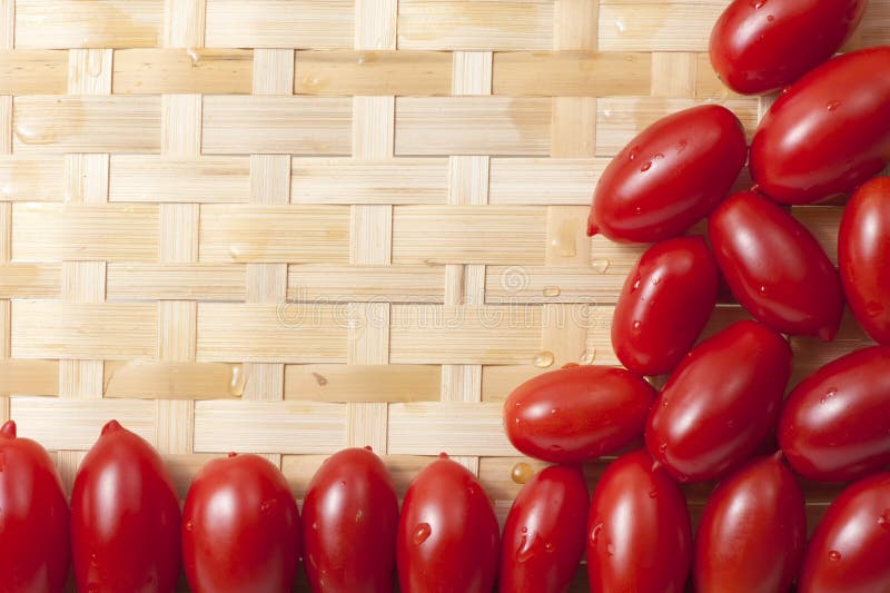 Small red oblong tomatoes stock image. Image of cuisine - 84305809